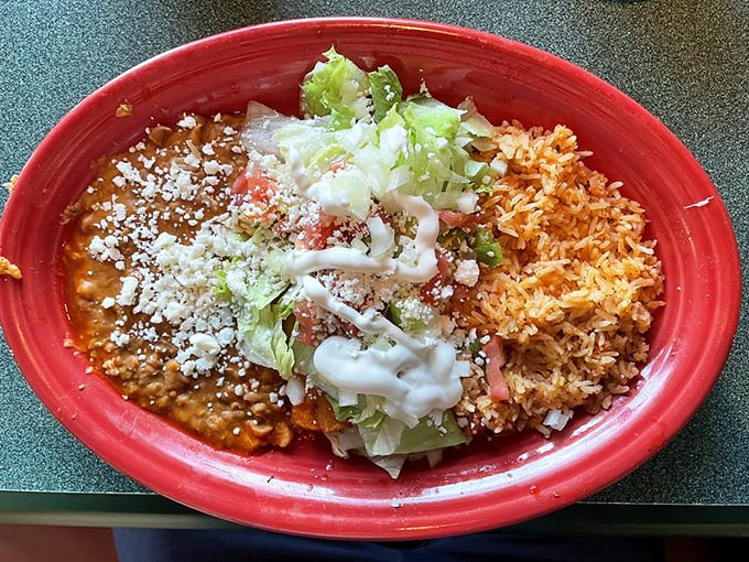 Enchiladas wearing their finest outfit: red sauce, melted cheese, and a sprinkle of cotija. Formal attire for your taste buds.