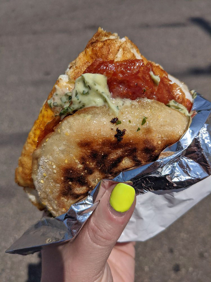 Breakfast ambitions realized between two halves of a toasted English muffin. Simple ingredients achieving sandwich immortality.