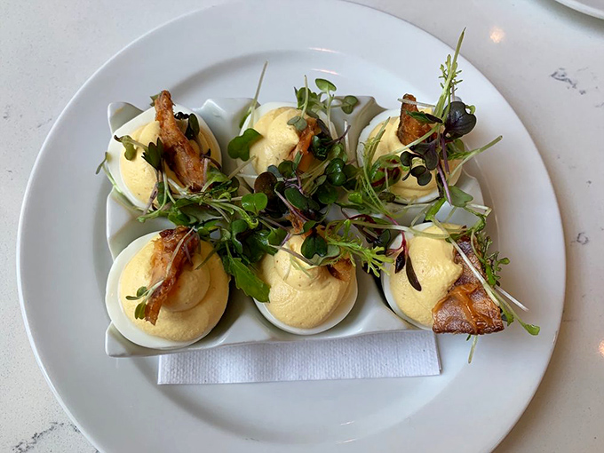 Farm-style deviled eggs with microgreens and bacon that make you question why you ever settled for the plain versions at family reunions.