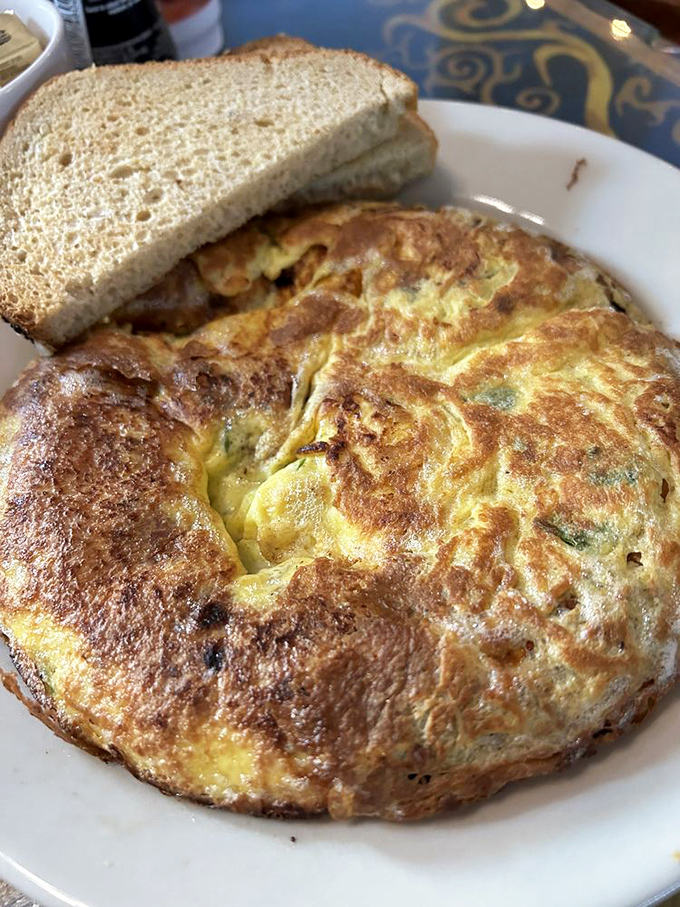The Farmer's Breakfast frittata&mdash;where farm-fresh ingredients meet culinary salvation. A golden disc of breakfast perfection with toast to soak up every bite.