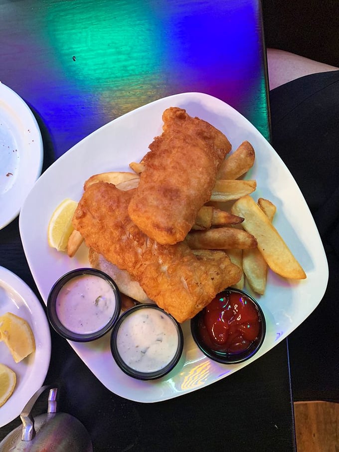 Fish and chips elevated to art form, with dipping sauces standing by like loyal sidekicks ready to enhance your flavor adventure.
