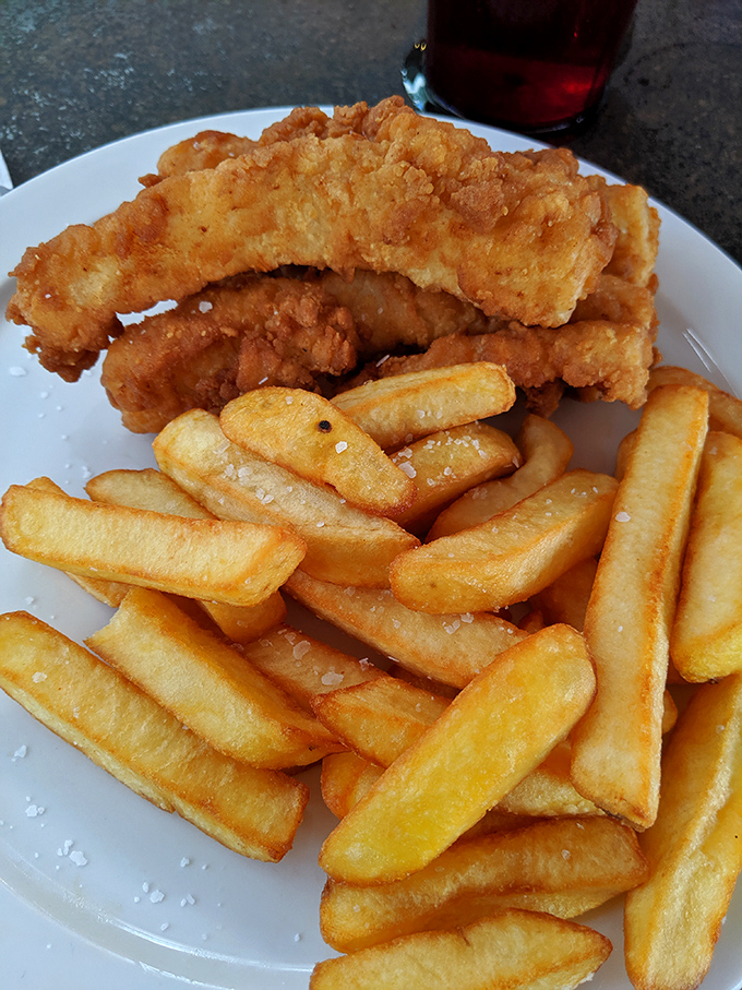 The Fish and Chips arrive looking like they just won a golden-brown beauty pageant &ndash; crispy, substantial, and demanding to be doused in malt vinegar.