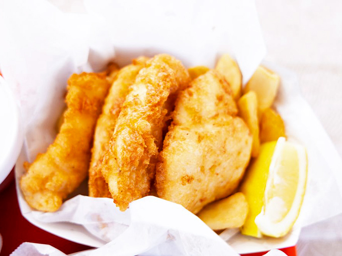 The fish and chips that launched a thousand return trips. Crispy, golden batter protecting flaky white fish&mdash;a combination that's caused more joy than should be legal.