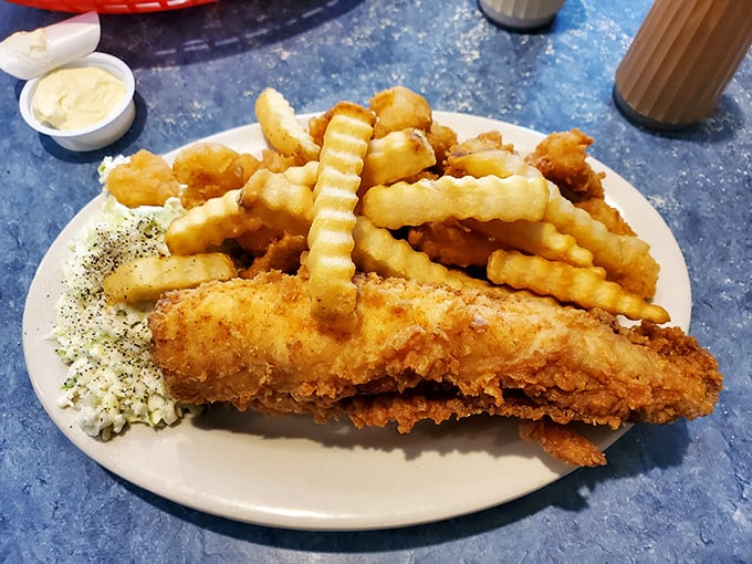 Golden-fried fish flanked by crispy fries and fresh slaw&mdash;the holy trinity of coastal comfort food that makes everything right with the world.