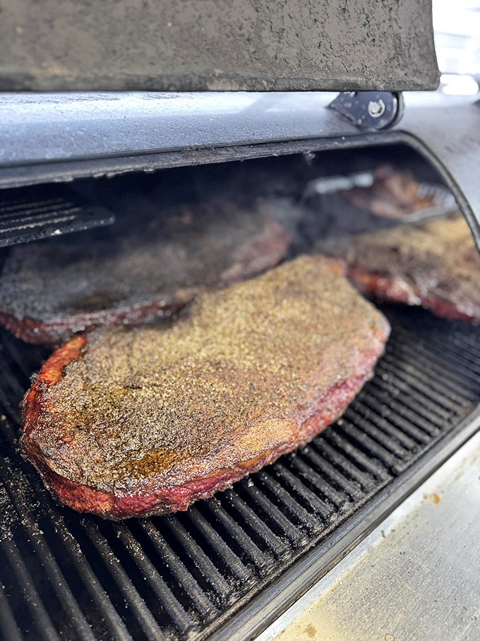 This isn't just cooking, it's meat alchemy. The rub-crusted brisket sizzling on the grill is about to make someone's day infinitely better.