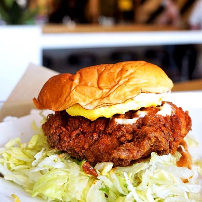 The fried chicken sandwich that launched a thousand cravings. A Hawaiian bun cradles crispy chicken, creamy sauce, and shredded lettuce in perfect harmony.