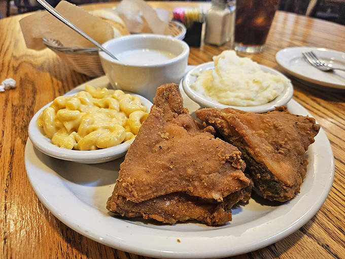 The holy trinity of Southern comfort: perfectly crispy fried chicken flanked by creamy mac and cheese and cloud-like mashed potatoes. Diet starts tomorrow!
