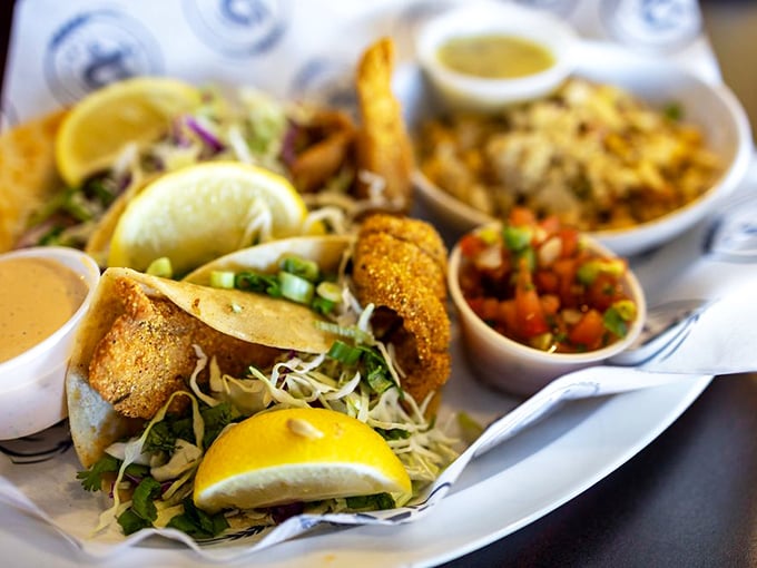 Fish tacos that would make coastal towns jealous. The perfect marriage of crispy cornmeal coating, fresh slaw, and zesty sauce.
