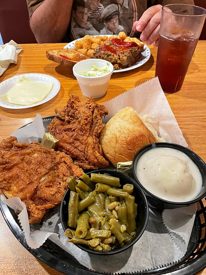 This isn't just a meal; it's edible architecture&mdash;a masterpiece of crispy chicken, tender green beans, and that roll standing guard.
