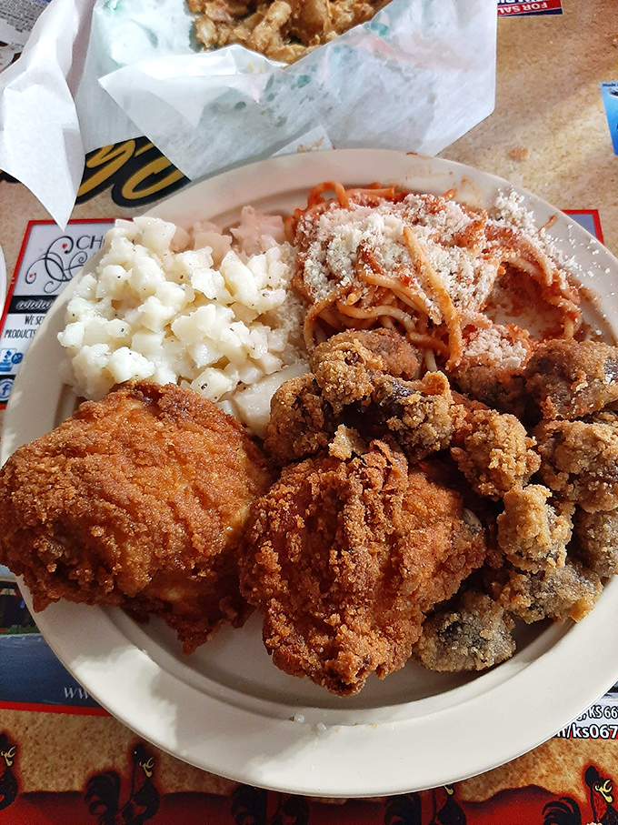 A plate that tells the whole story: crispy chicken, creamy mac, and spaghetti that would make any Italian grandmother nod in respectful approval.