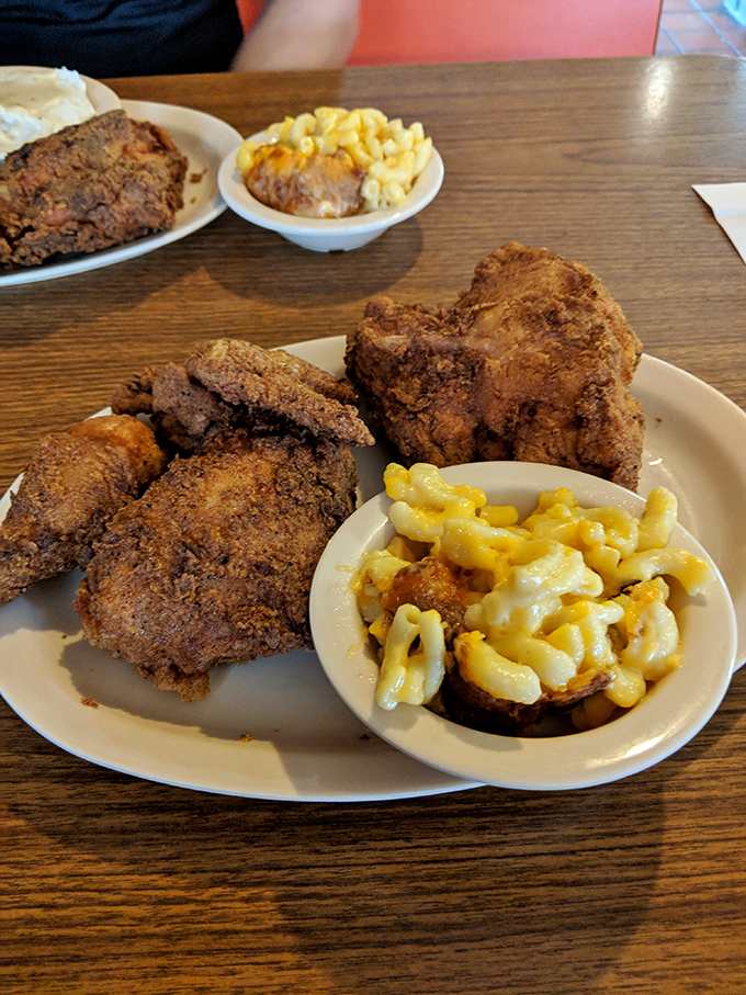 This isn't just fried chicken; it's edible nostalgia served with mac and cheese that could make your grandmother jealous.