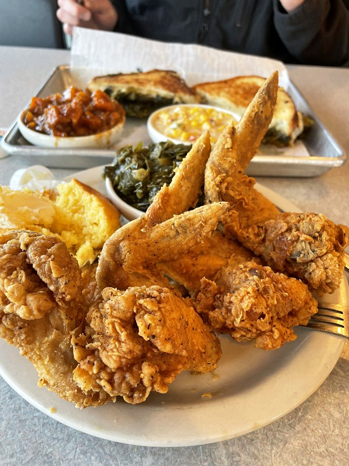 This isn't just lunch&mdash;it's edible artwork. Crispy chicken, tender greens, and cornbread that would make angels weep with joy.