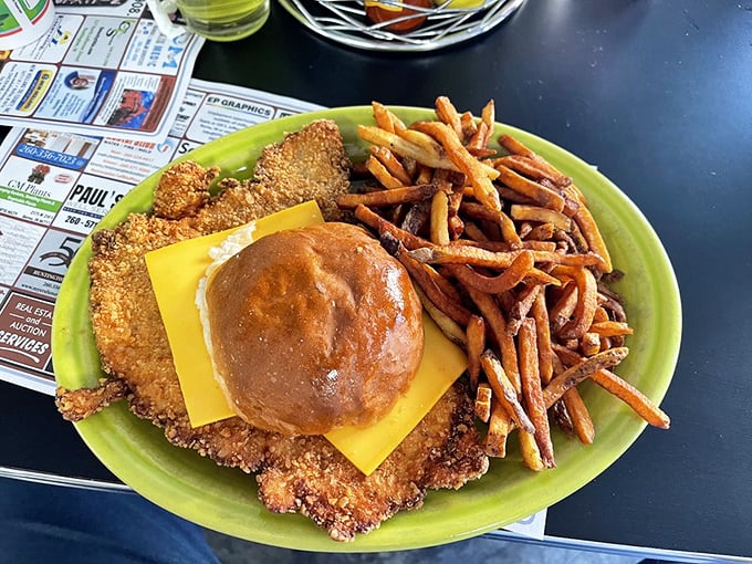 The ultimate Hoosier handshake: a tenderloin the size of your face meeting a modest bun that knows its place in the world.