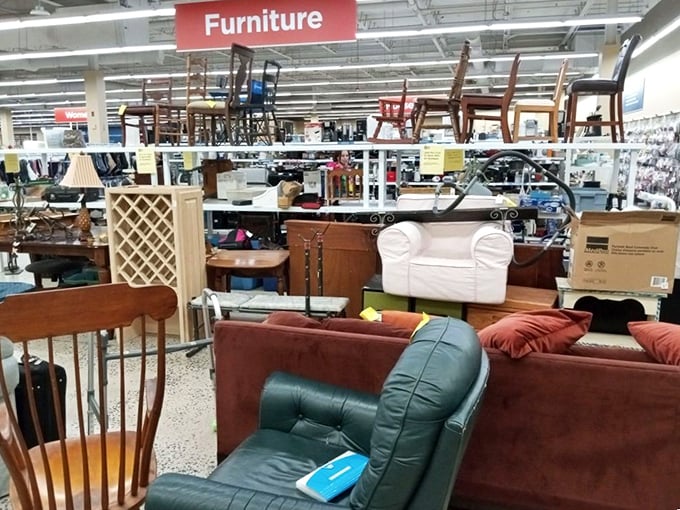The furniture section: where retired recliners and displaced dining sets await adoption. That green leather chair has definitely seen some Netflix marathons in its day.