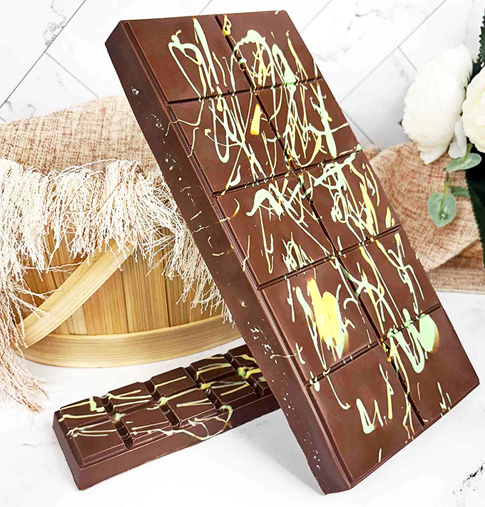 Chocolate artistry that makes Jackson Pollock look restrained. These splatter-designed bars are edible masterpieces waiting to be broken.