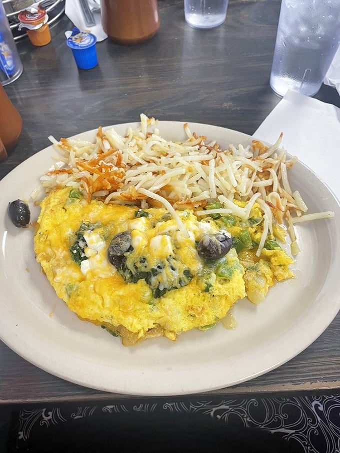 This Greek omelet doesn't just whisper "good morning"—it belts out a full Mediterranean opera with every cheese-laden bite.