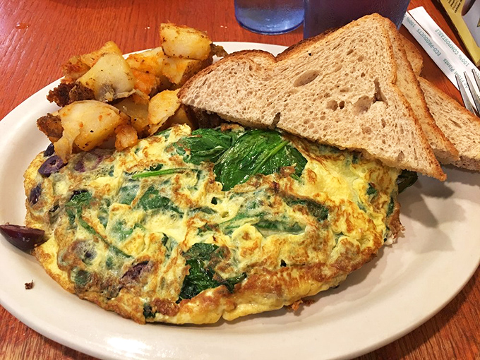 This isn't just an omelet&mdash;it's an architectural achievement of eggs, potatoes, and toast that would make Frank Lloyd Wright jealous.