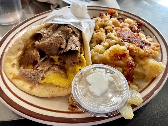 The gyro breakfast sandwich—where Mediterranean meets Mountain West. Those crispy hash browns are the supporting actors who steal the scene.