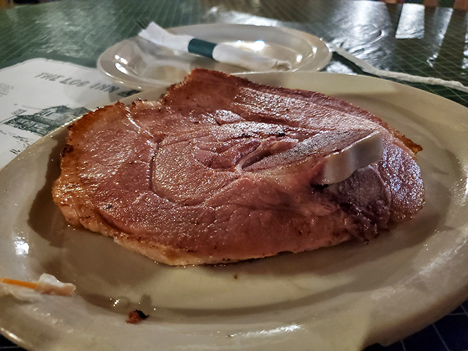 Carnivore nirvana on a white plate. This ham cut is so generous it makes you wonder if pigs in Indiana are secretly the size of Clydesdales.