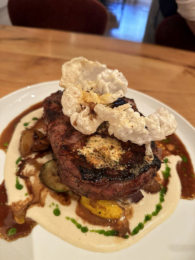 Not just a steak, but a masterpiece—the kind that makes you wonder if you should take a picture or just dive in face-first.