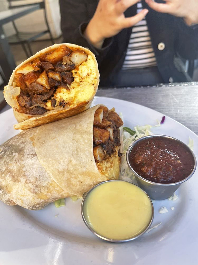 The Hash-a-Burrito: where steak and eggs decided to elope, wrapped themselves in a tortilla, and lived happily ever after. Those sauces are just wedding gifts.