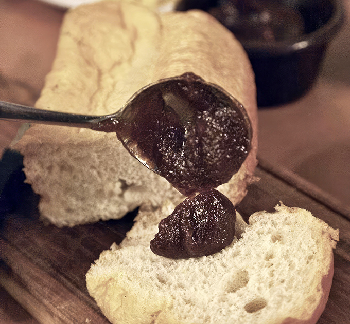 The apple butter glistens with promise as it's spread on fresh-baked bread. A sweet prelude that's been starting Monte Ne meals for generations.