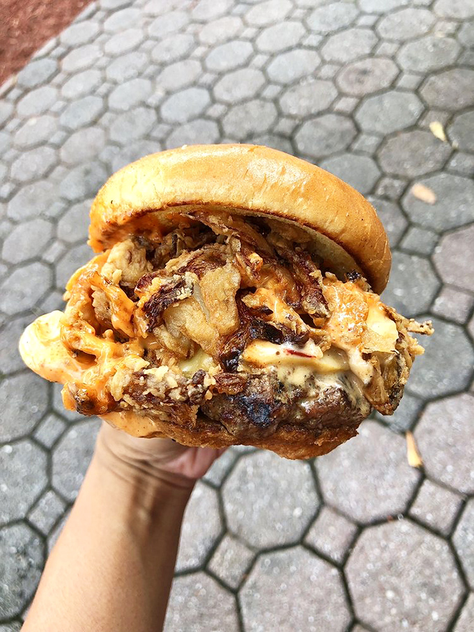 The Hot Mess lives up to its name in the best possible way&mdash;a glorious avalanche of caramelized onions and melted cheese cascading over beef.