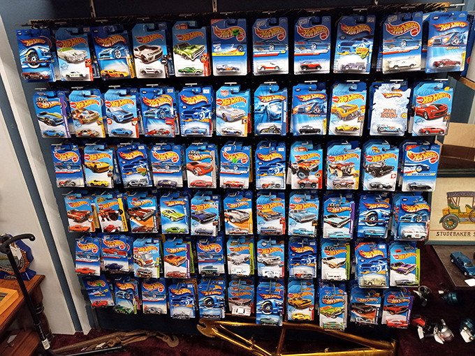 Hot Wheels heaven! This wall of miniature automotive history proves one collector's obsession is another's dream discovery. Childhood nostalgia, perfectly preserved in plastic.