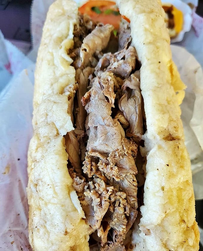 Behold the Italian beef in all its thinly-sliced glory. The bread's heroic struggle to contain all that savory goodness deserves a medal of honor.