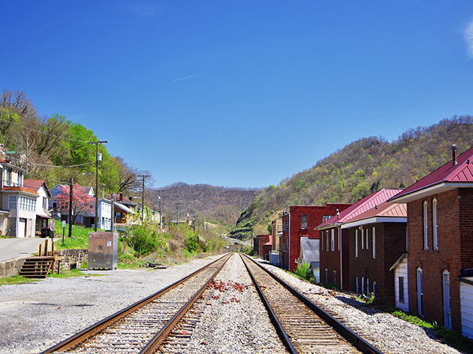 These tracks once carried coal that powered America's growth. Now they offer a perfect frame for Logan's blend of industry and natural beauty.