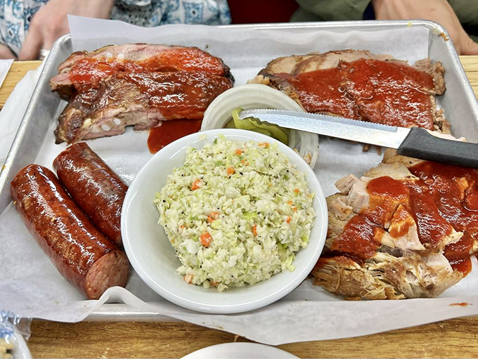 A barbecue platter that makes vegetarians question their life choices. That smoke ring is nature's way of saying "you're welcome."