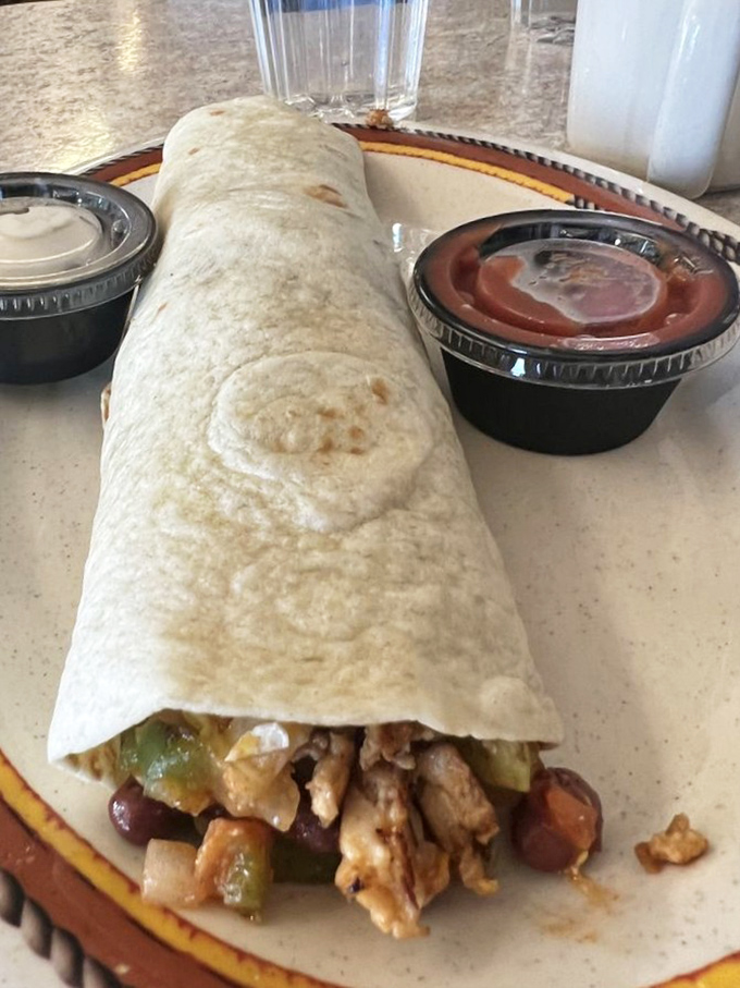 This burrito doesn't just break your fast; it demolishes hunger with a perfect ratio of meat, veggies, and beans.