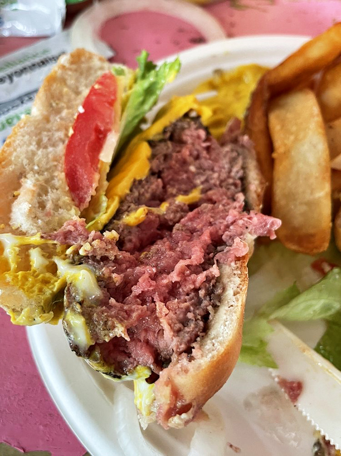 The cross-section that burger dreams are made of. Medium-rare perfection that makes you wonder why you ever settled for drive-thru mediocrity.