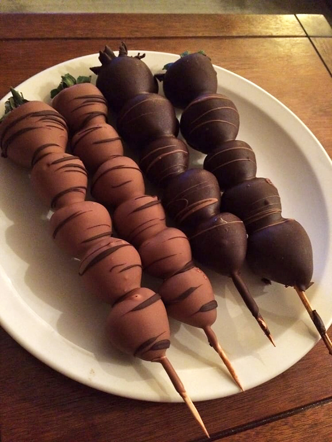 Chocolate-dipped strawberries on parade, dressed in their formal milk and dark chocolate attire. Nature's candy wrapped in mankind's greatest invention.
