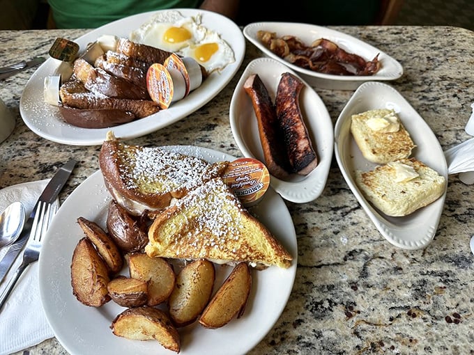 Breakfast royalty has arrived. Golden French toast, perfectly crisped potatoes, and breakfast meats create a plate that demands both a fork and respect.
