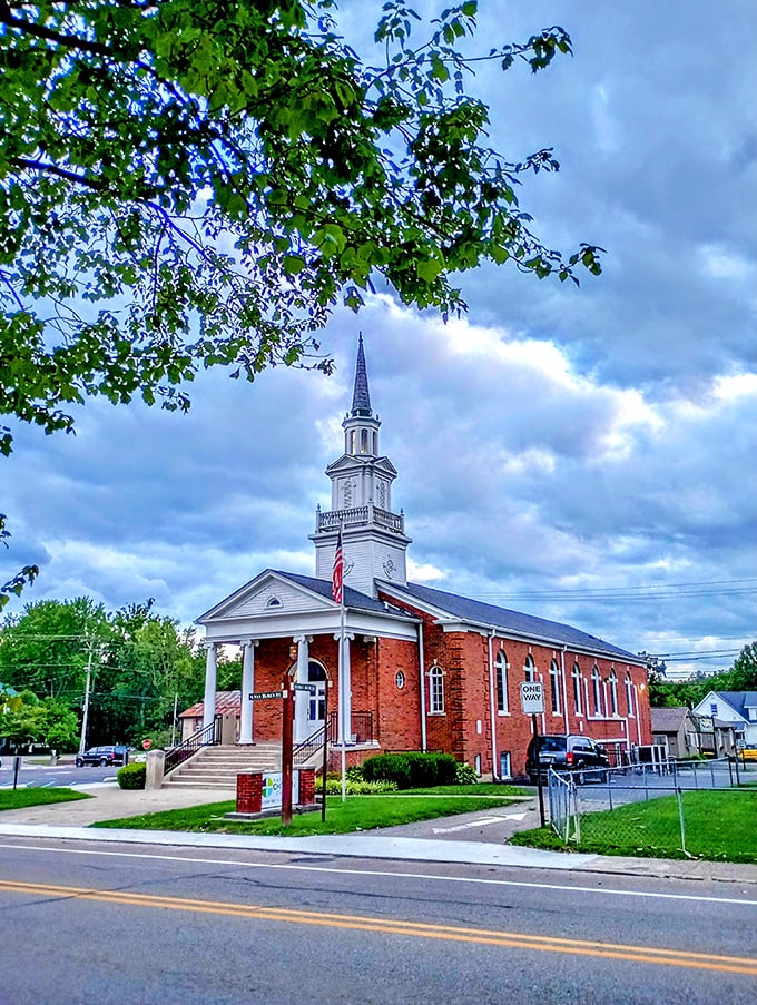The Nashville Christian Church's pristine white steeple reaches skyward, a spiritual lighthouse guiding travelers through the rolling hills of Brown County.