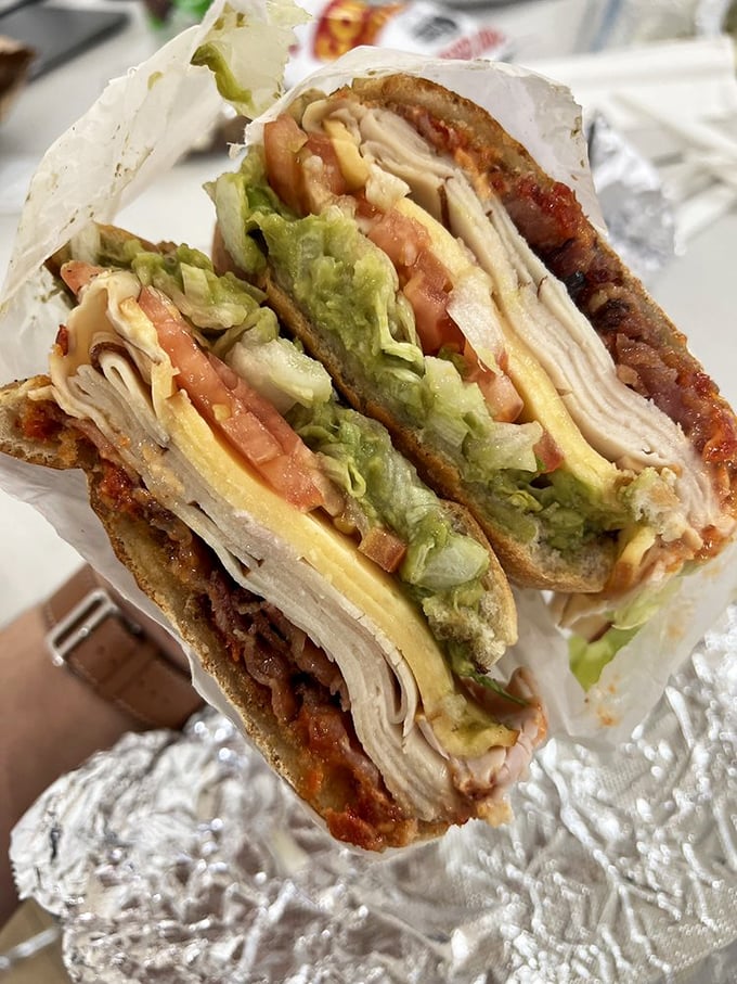 Architectural marvel meets lunch break salvation&mdash;layers of turkey, bacon, and fresh veggies creating the skyscraper of sandwiches your mouth deserves.