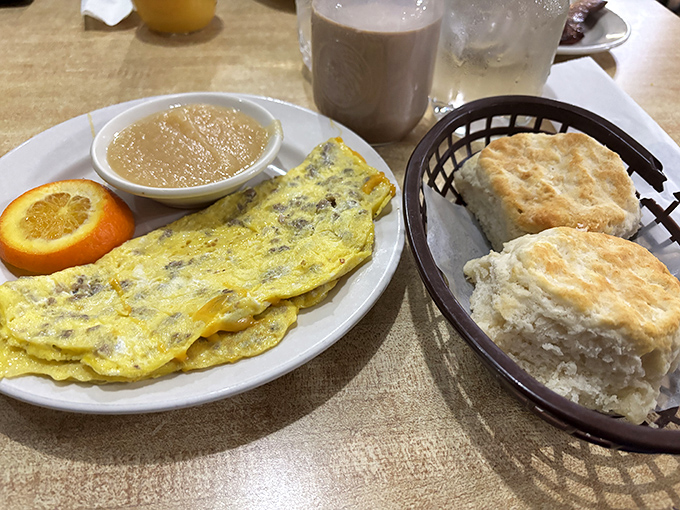 The folded omelet's melty interior and fresh-baked biscuits could make a grown person weep. Comfort food engineering at its finest.
