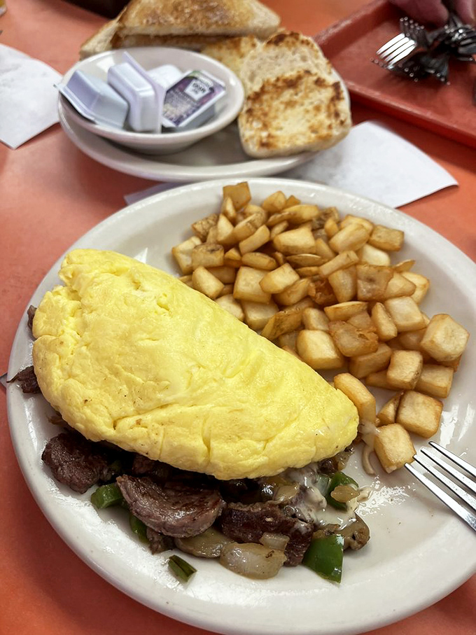 Steakhouse meets breakfast club in this fluffy yellow marvel. The chef clearly understands that breakfast deserves the same respect as dinner.