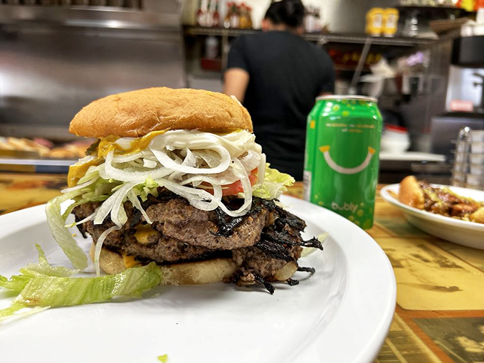 Behold the architectural marvel that is Sid's onion burger&mdash;layers of beef, cheese, and those signature onions that have become one with the patty.