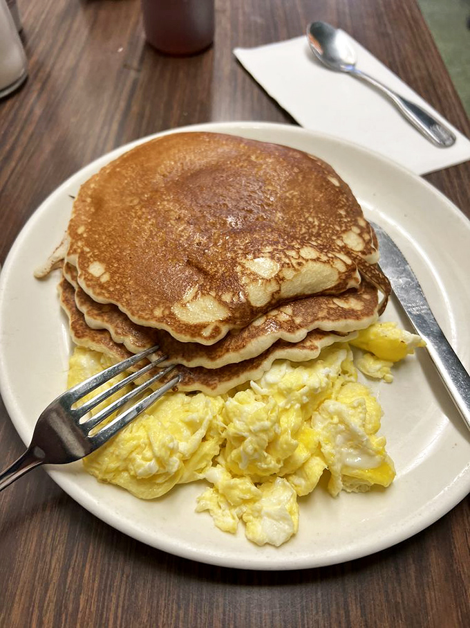 Pancake perfection doesn't need to wear fancy clothes. Golden-brown discs with scrambled eggs &ndash; the breakfast equivalent of a warm hug.