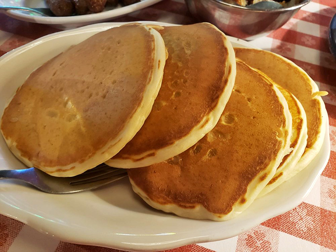 These aren't just pancakes&mdash;they're golden discs of happiness stacked higher than my cholesterol after eating them. Worth every delicious bite!