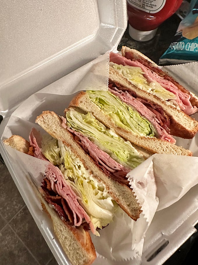 Club sandwiches stacked higher than my college textbooks. That perfect cross-section reveals the architectural marvel that is properly layered cold cuts and crisp lettuce.