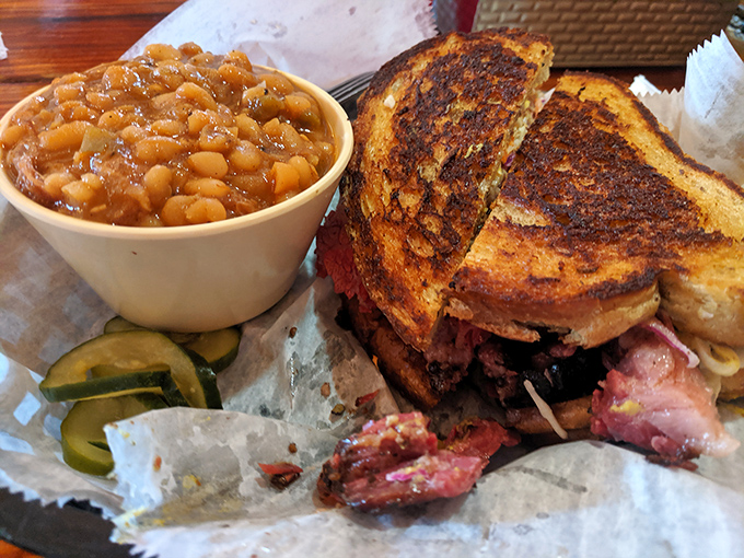 Behold: a sandwich that justifies elastic waistbands. Toasted bread barely containing smoky meat alongside baked beans that clearly weren't an afterthought.