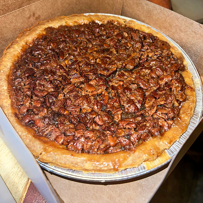 Pecan pie so densely packed with nuts, it could survive reentry into Earth's atmosphere. The kind of dessert that makes you involuntarily close your eyes when taking a bite.