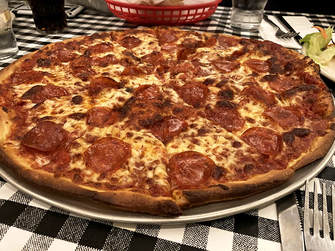 Pepperoni that curls into little flavor cups, collecting precious oils like tiny edible chalices. This is pizza engineering at its finest.
