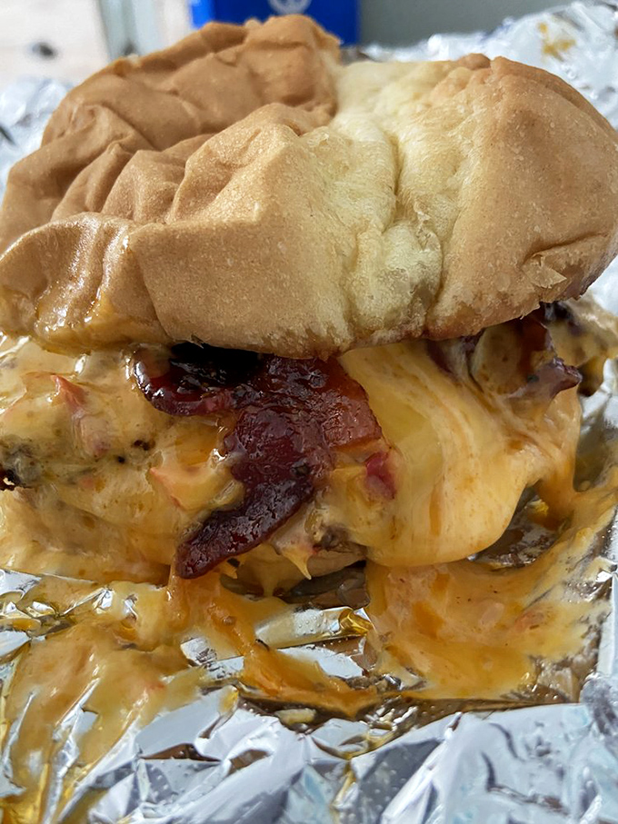 Melted pimento cheese cascades over bacon that's been candied to perfection. This isn't a burger; it's a Southern love letter.