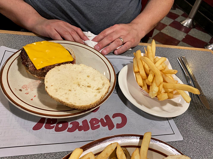 Simplicity perfected: a naked burger reveals itself in all its glory, waiting for its top bun like Michelangelo's David waiting for his robe.