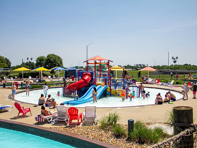 The children's play area: where tiny humans discover the joy of getting splashed while parents discover the joy of not being the ones doing the splashing.