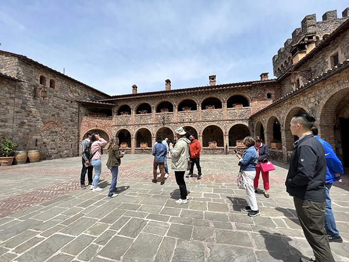 The courtyard bustles with visitors experiencing 13th-century architecture without 13th-century plumbing. A historical win-win if you ask me.